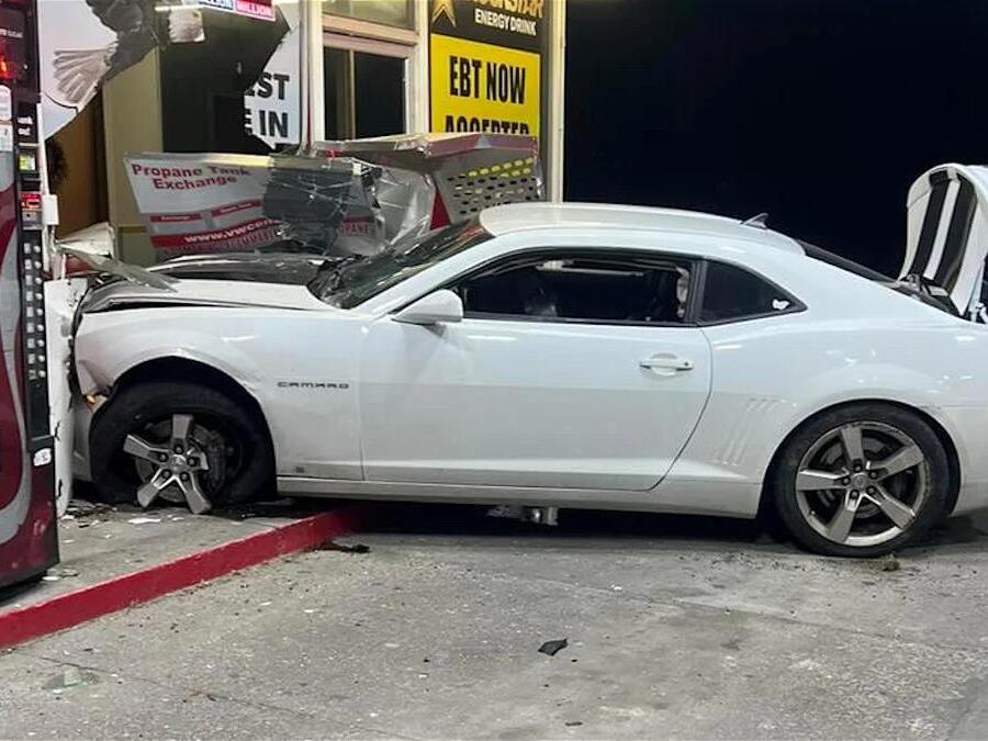 Car crashes into store after high-speed chase
