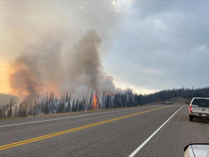 FIRE WATCH: Firefighters work to control spot fires along Highway 26 on ...