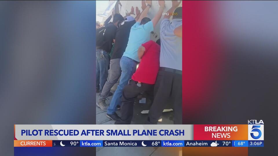 Good Samaritans lift small plane to free pilot after crash into store ...