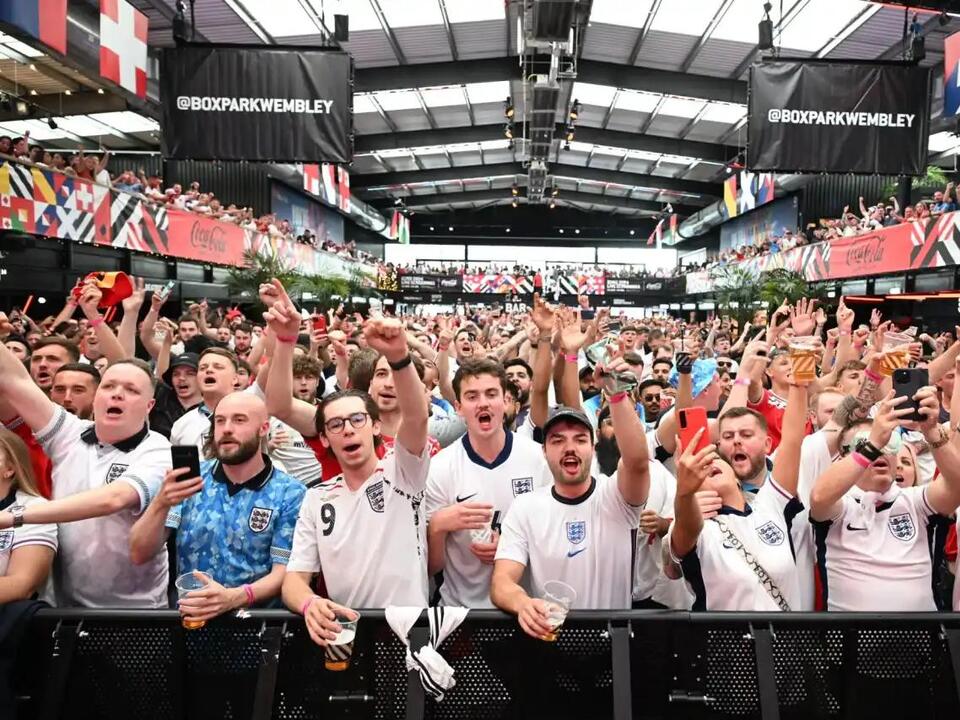 Devastated England fans drown their sorrows as Three Lions lose Euros ...