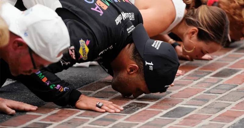 Denny Hamlin pressed on superstition after kissing the bricks with ...