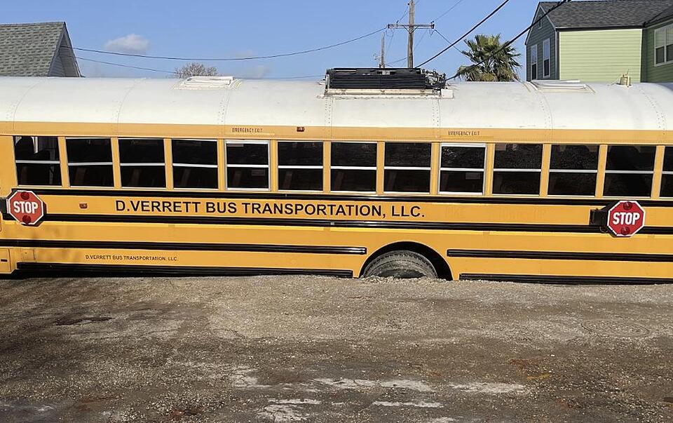 New Orleans School Bus Sinks in Collapsed Portion of Roadway - NewsBreak