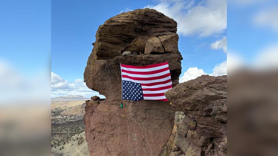 American flag hung upside down at Smith Rock to protest threat to ...