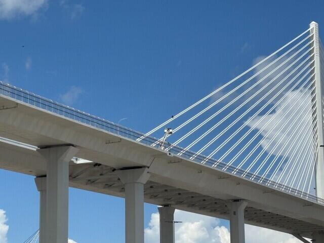 Man safe after climbing up cable of New Harbor Bridge - NewsBreak
