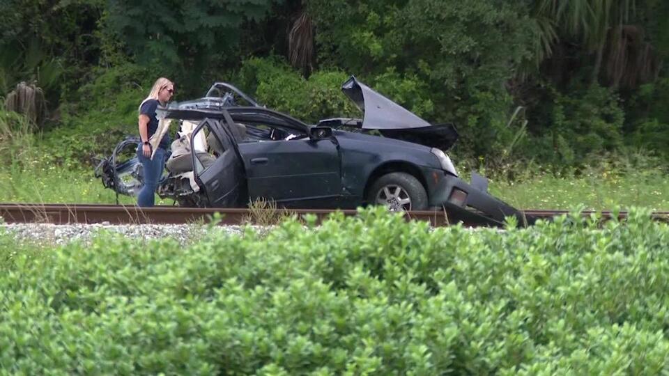 VIDEO: Train crashes into car that drove past railroad barrier ...