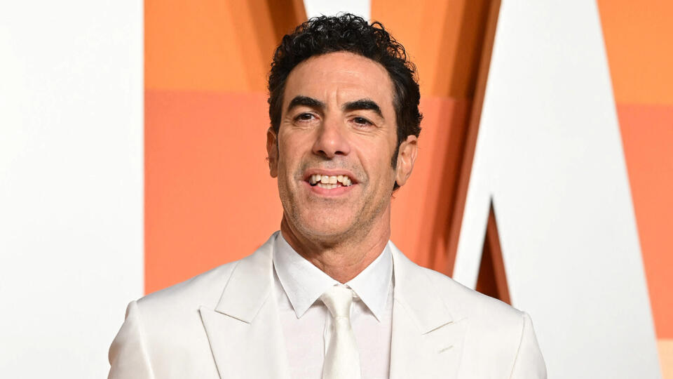 Sacha Baron Cohen Jokes He’s ‘Hard-Launching’ His ‘Mid-Life Crisis’ as ...