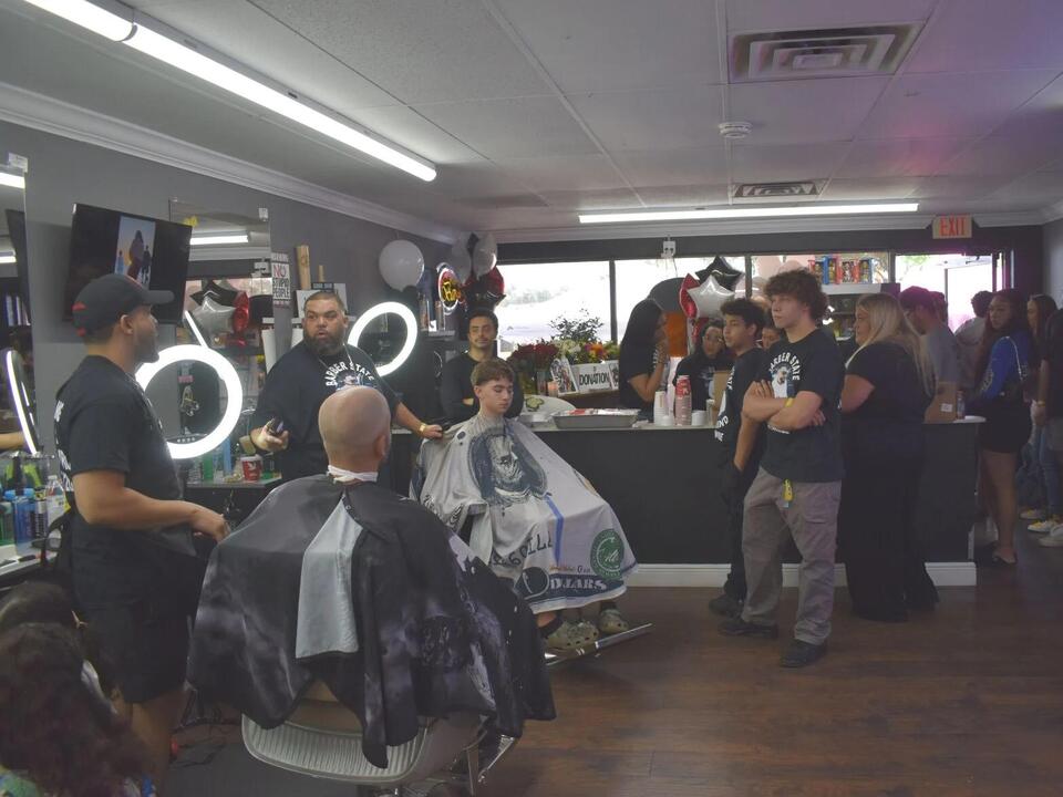 Community members remember beloved barber, father