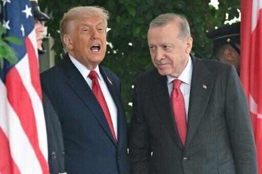 US President Donald Trump greets Turkey's President Recep Tayyip Erdogan as Erdogan arrives at ...