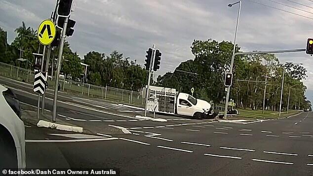 Traffic stopper! Shocking moment a ute swerves straight into a light ...