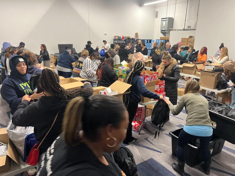Volunteers with Evolve Community prepare hundreds of care kits for the homeless - NewsBreak