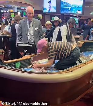 Woman climbs onto craps table at Silver Legacy Casino in Las Vegas and ...