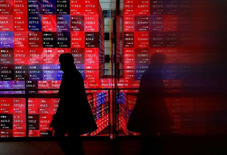 Japan's Nikkei ends at record high as automakers rise on weaker yen ...