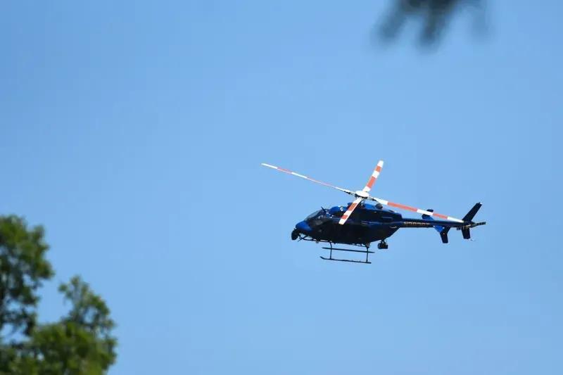 Man arrested for shining laser at Michigan State Police helicopter in ...