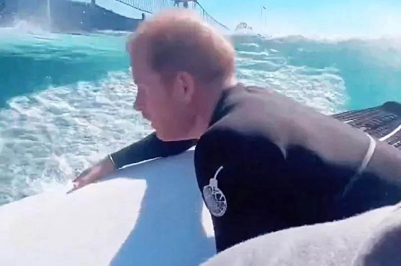 Prince Harry spotted teaching son Prince Archie how to surf in rare ...