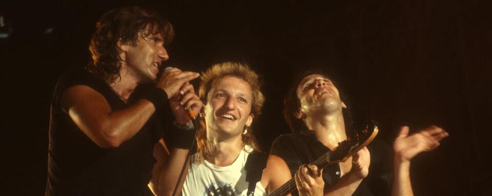 The Story and Meaning Behind “On the Dark Side,” the John Cafferty ...
