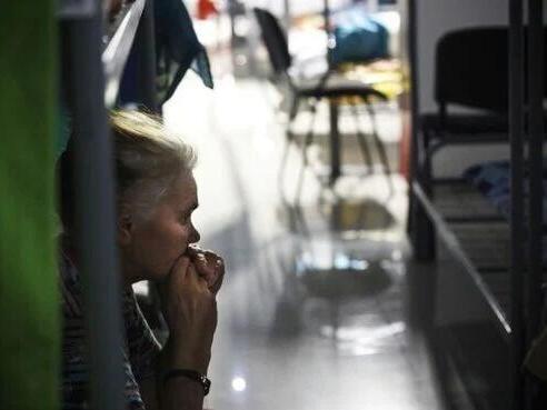 War-displaced people spend time in a centre for displaced people in ...