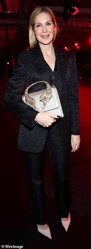 Kelly Rutherford looks effortlessly chic in a black satin suit at ...