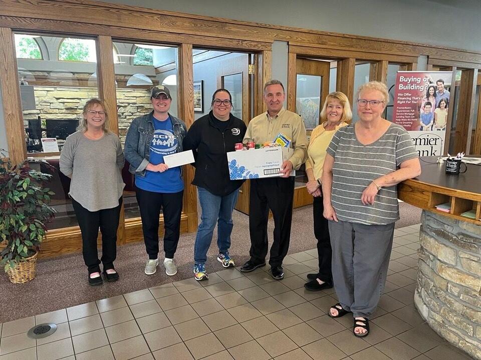 PremierBank celebrates Community Banking Month with food bank ...