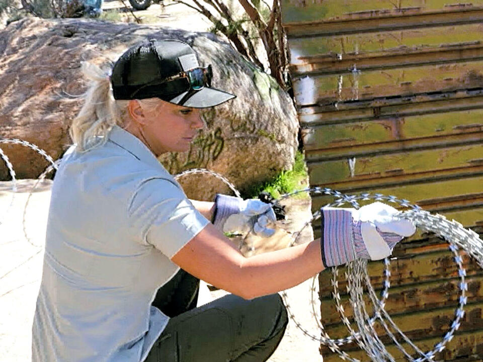 ‘Border Vets’ install razor wire at U.S.-Mexico border wall in Jacumba