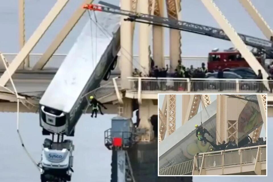 Driver pulled from truck dangling from Louisville bridge over Ohio ...
