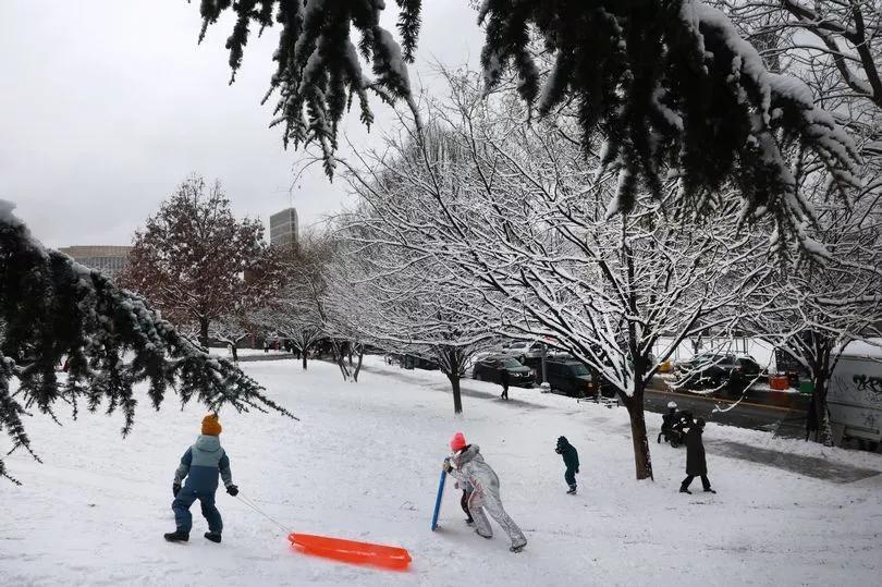 New Yorkers sled through historic snowfall after massive polar blizzard ...