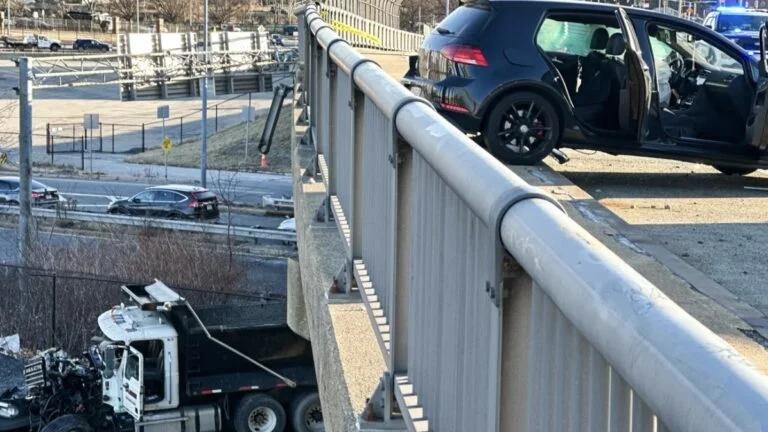Dump truck plunges off Boston overpass after colliding with car - NewsBreak