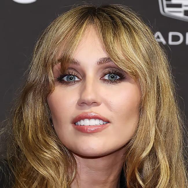Miley Cyrus Leaves Fans Speechless In An Asymmetrical Orange Fringe Top ...