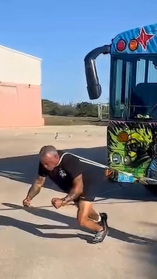 Watch: Athlete pulls 21,737-pound bus with his neck - NewsBreak