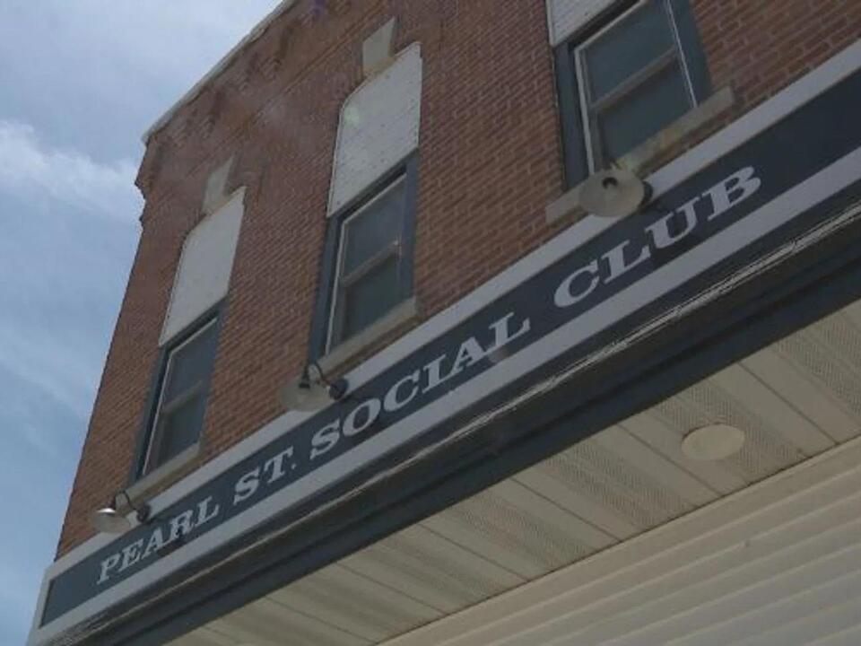 Local sign painter helps restore iconic mural in Shellsburg on Thursday