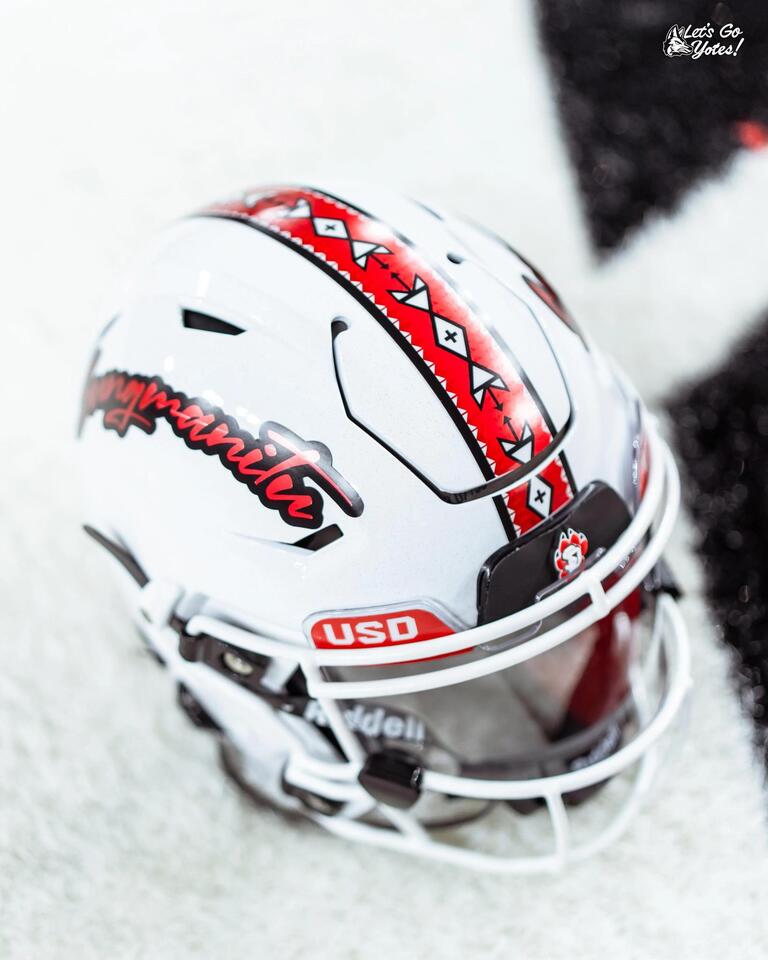 University of South Dakota football wearing new Lakota helmet design on ...