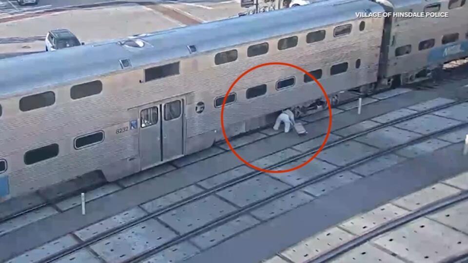 Dramatic video shows woman crawl under Metra train in west suburbs ...