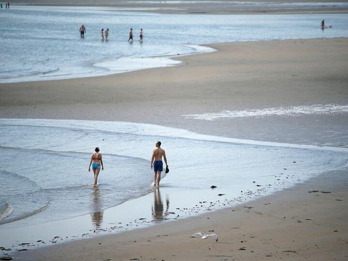 Woman sinks in quicksand 'in split second' on Maine beach in rare ...