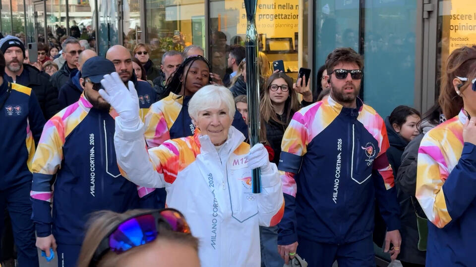 Gail Miller carries Olympic torch through Milan ahead of 2026 Games ...