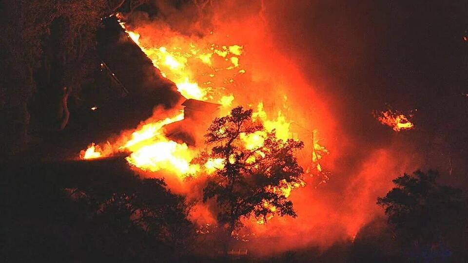 Crews battle large grass fire off Highway 281 North as flames threaten ...