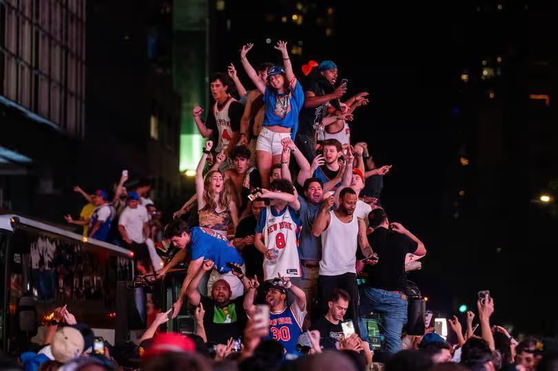 Unruly Knicks fans trash yellow bus as celebrations threaten to turn ...