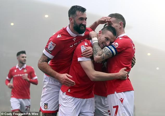 Wrexham sign former England international on an 18-month deal from ...