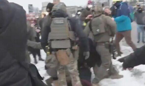 ICE agents shove women to the ground and Minnesota protestors cry ...