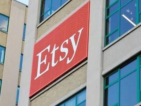 The Etsy company logo is seen at its New York headquarters building on ...