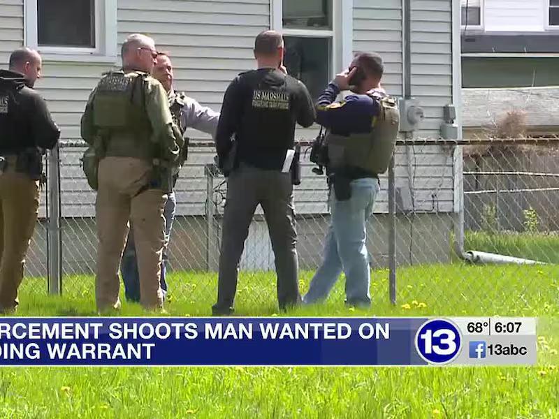 Law enforcement shoots man holding a gun in Toledo