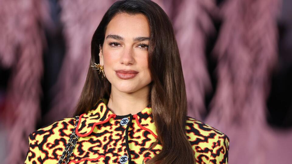 Dua Lipa’s Chanel Skirt Suit Look Sets Runway on Fire - NewsBreak