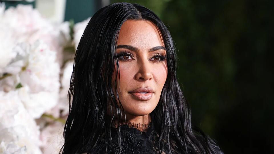 Kim Kardashian appears to be cheered on by Lewis Hamilton as she ...