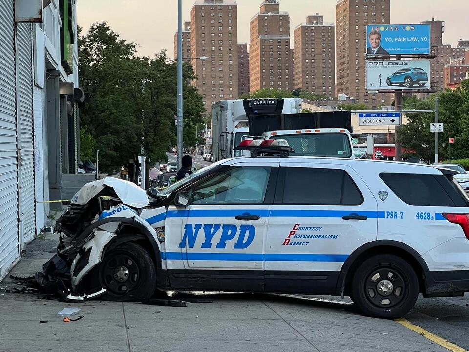 NYPD officers crash into car, storefront while responding to shooting ...