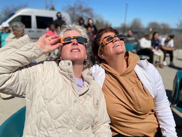 Strangers share solar eclipse glasses and a good time in Racine - NewsBreak