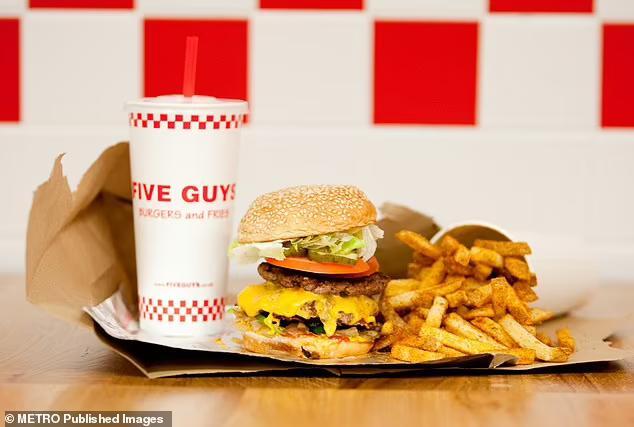 The REAL reason why Five Guys food bags always have 'extra' fries at ...