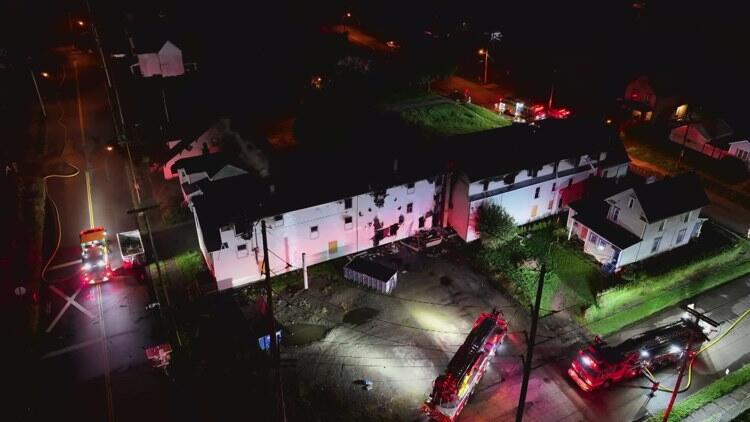 Firefighters search for possible victims after overnight apartment fire ...