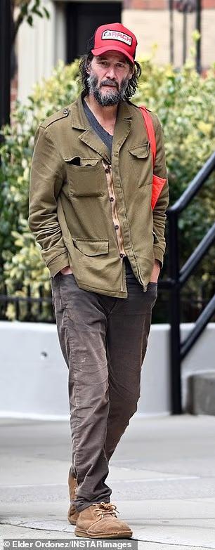 Scruffy Keanu Reeves cuts a lonely figure after being forced to deny ...