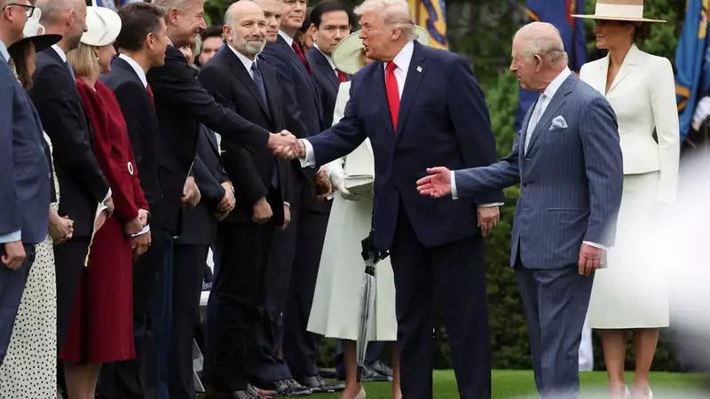 Trump barges in to greet own Cabinet as King Charles' handshake gets ...