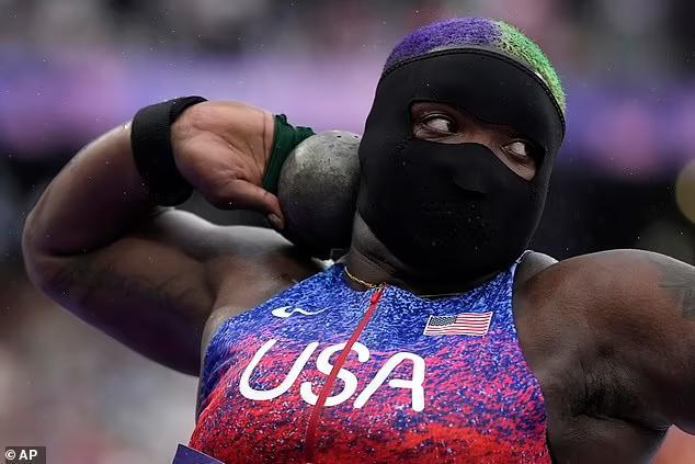 Non-binary Olympics star Raven Saunders pulls on their trademark mask ...