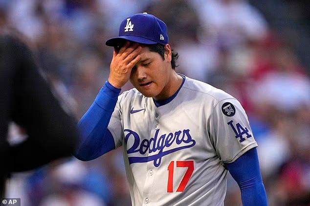 Baseball game descends into violent brawl as fan is knocked out cold ...