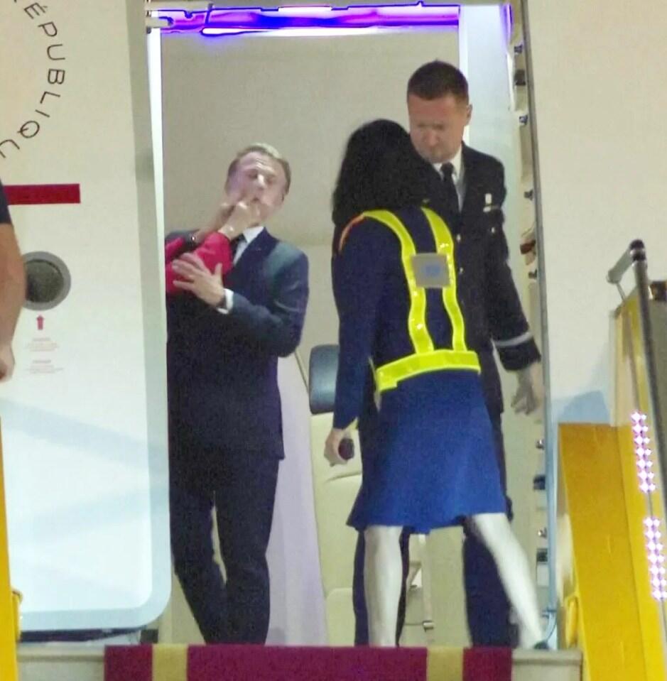 Bizarre moment Emmanuel Macron is SHOVED in face by wife Brigitte… as ...